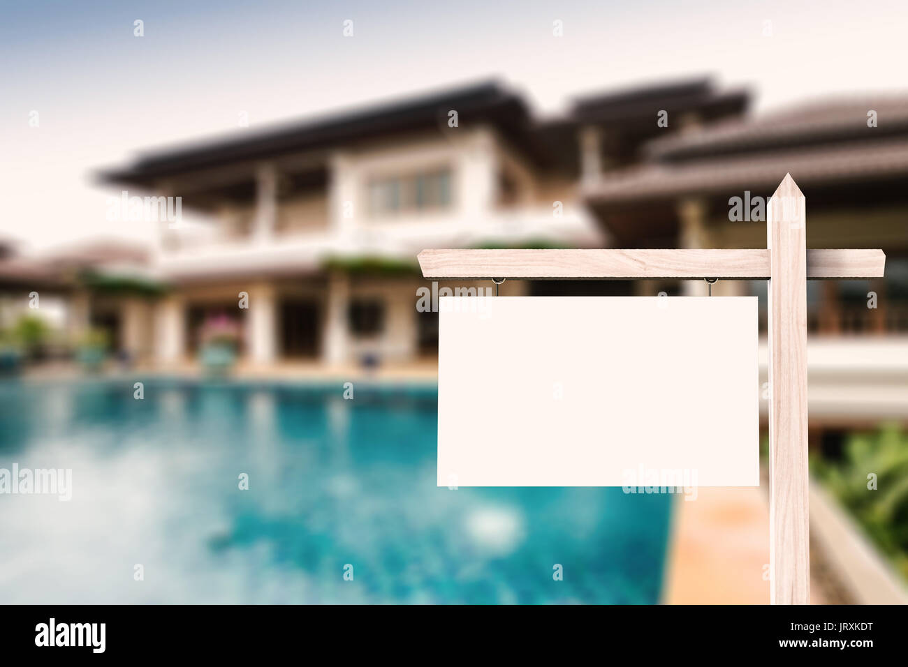 blank white sign with exterior house background Stock Photo - Alamy