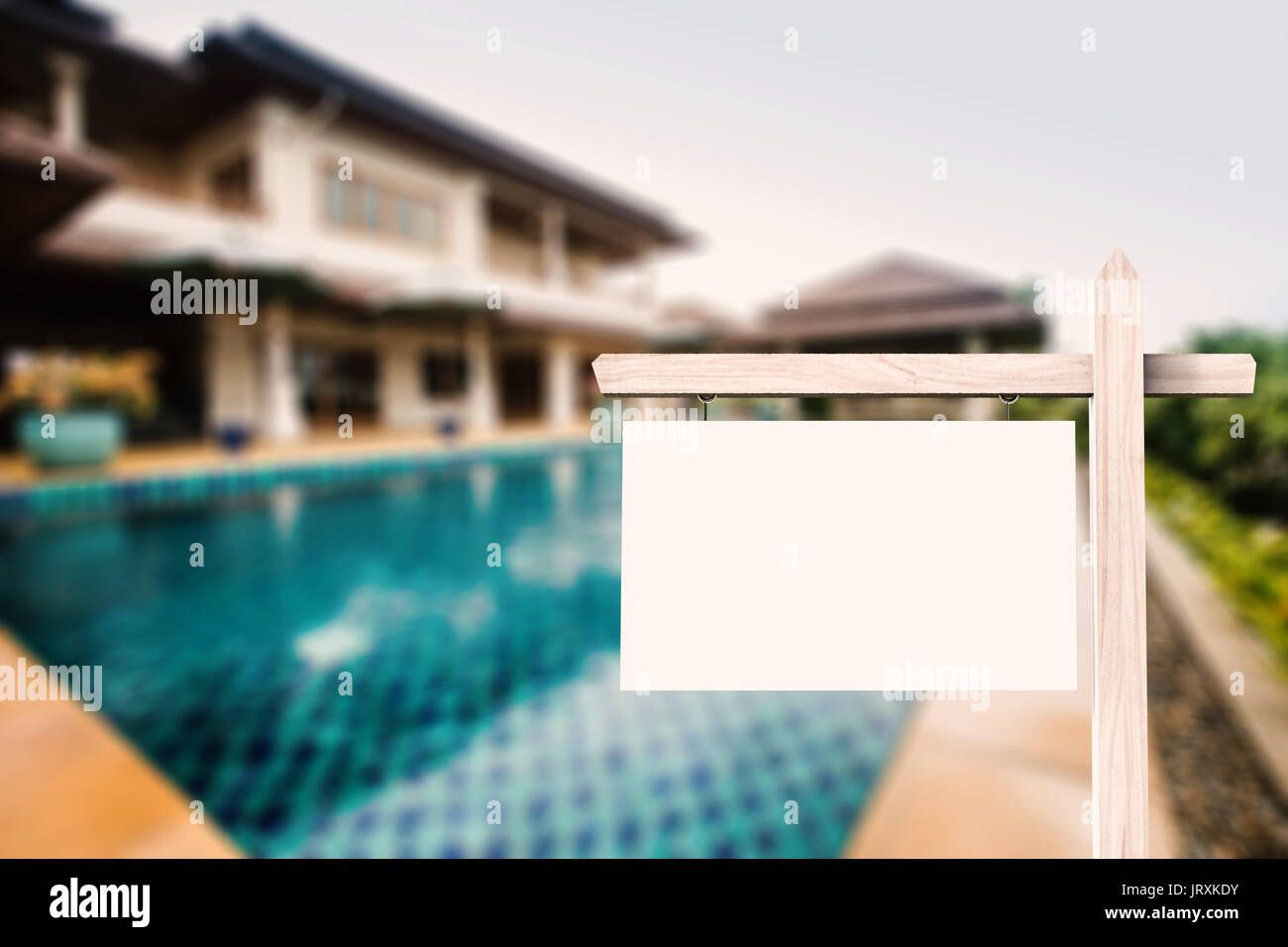 blank white sign with exterior house background Stock Photo - Alamy