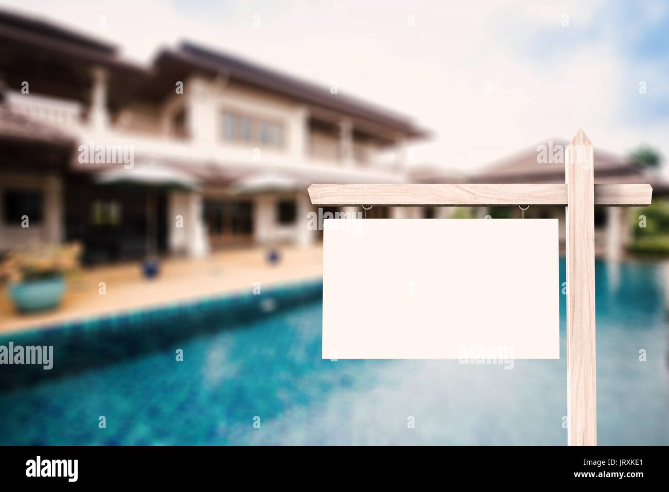 blank white sign with exterior house background Stock Photo - Alamy