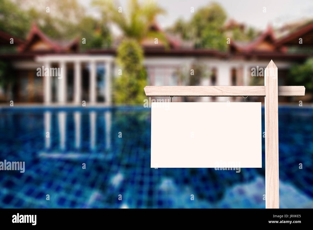 blank white sign with exterior house background Stock Photo - Alamy