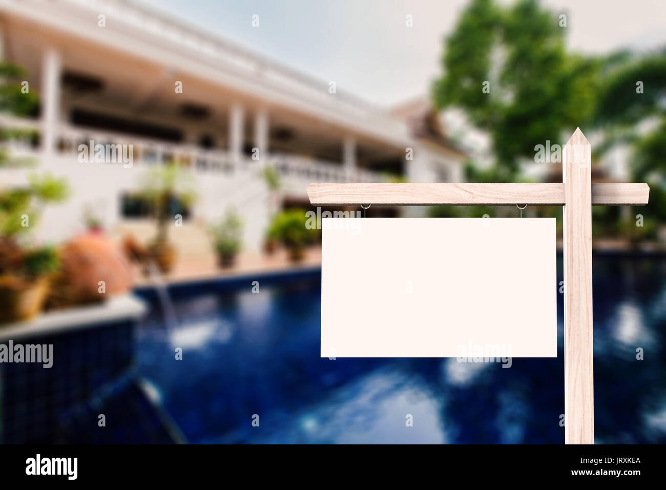 blank white sign with exterior house background Stock Photo - Alamy