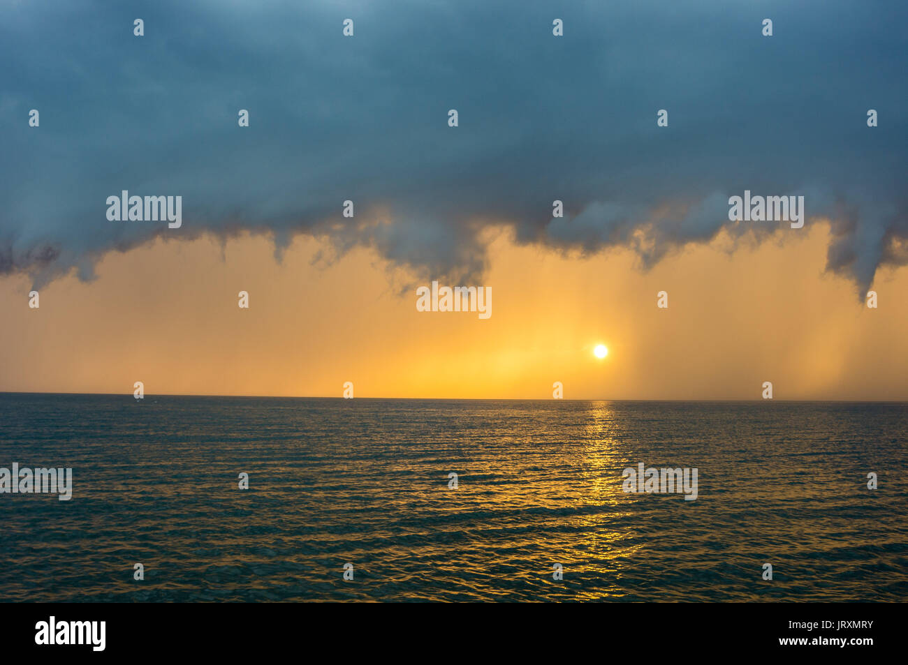 Sunset storm with rain over the Baltic Sea Niear Darlowo Pomerania ...