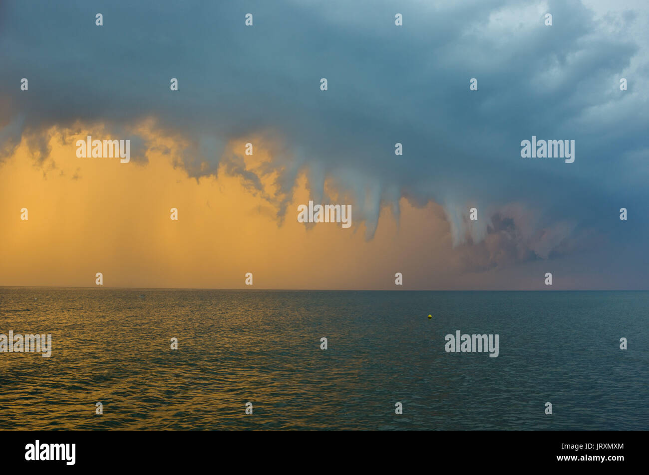 Sunset storm with rain over the Baltic Sea Niear Darlowo Pomerania ...