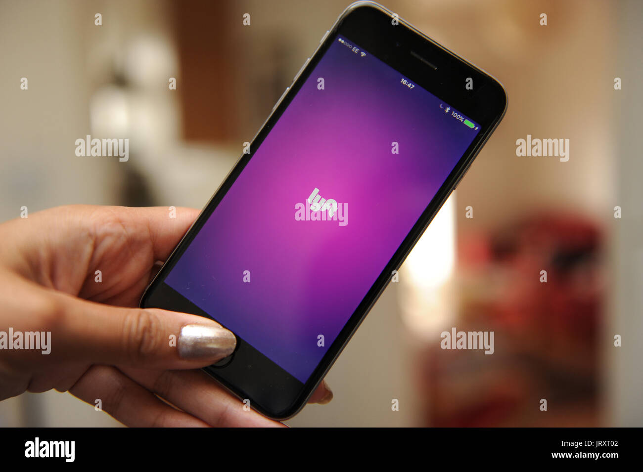 The Lyft app is seen on a phone screen, Lyft is a ride sharing company ...