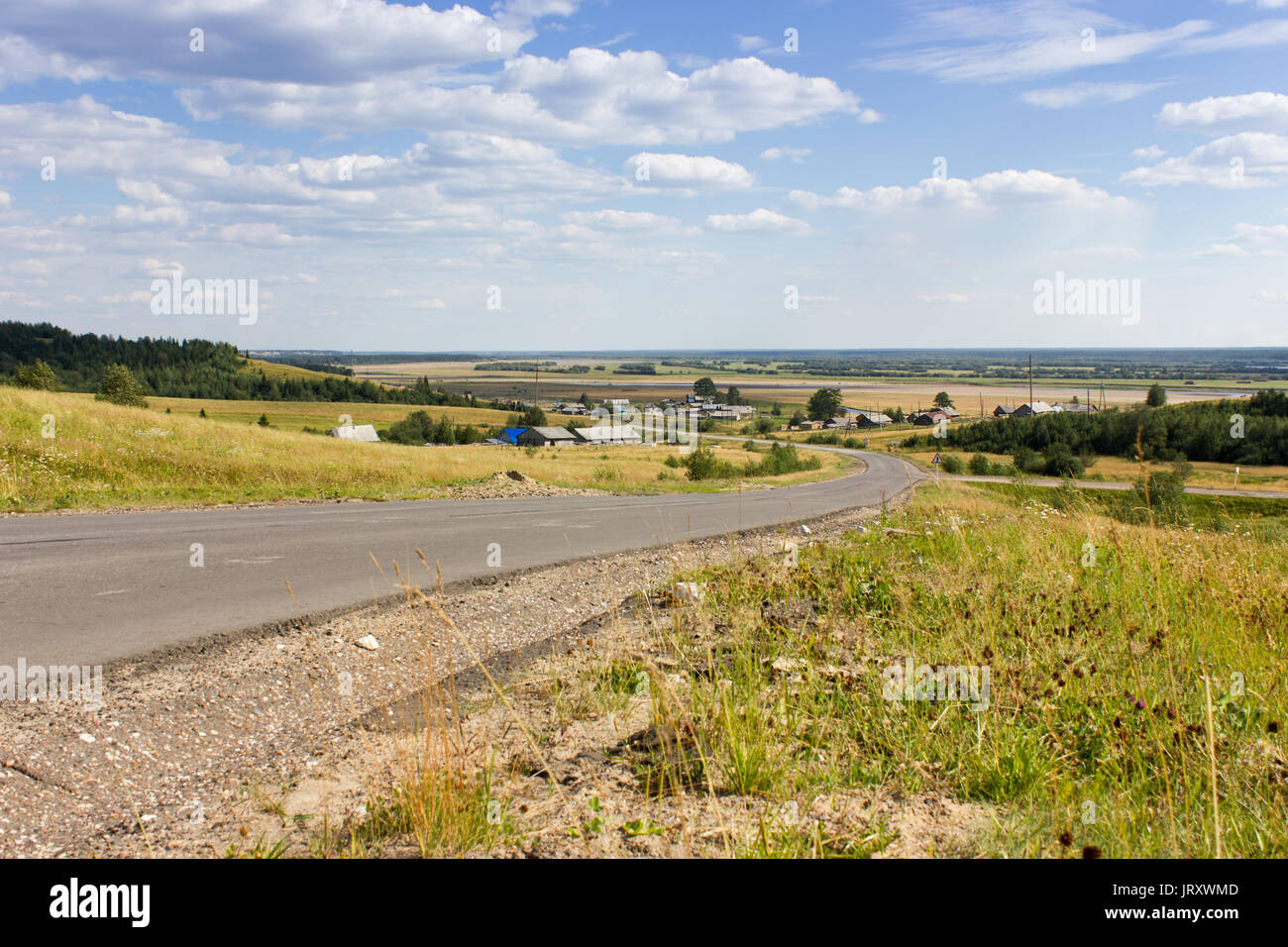 Rural landscape of small village with road at sunny day Stock Photo - Alamy