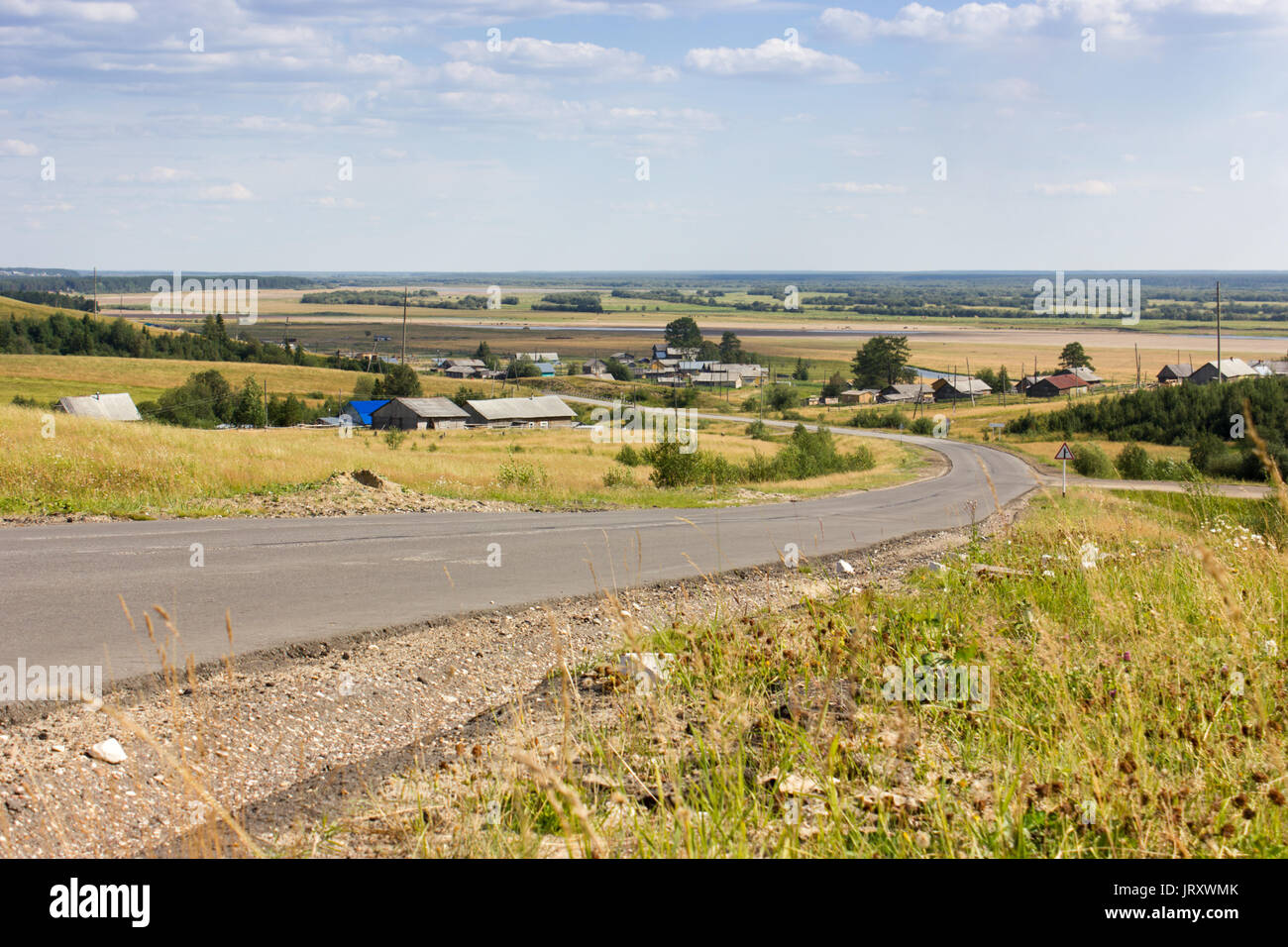 Rural landscape of small village with road at sunny day Stock Photo - Alamy