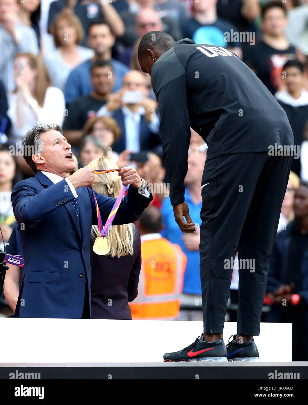 IAAF President Lord Sebastian Coe gives the gold medal to USA's Justin ...