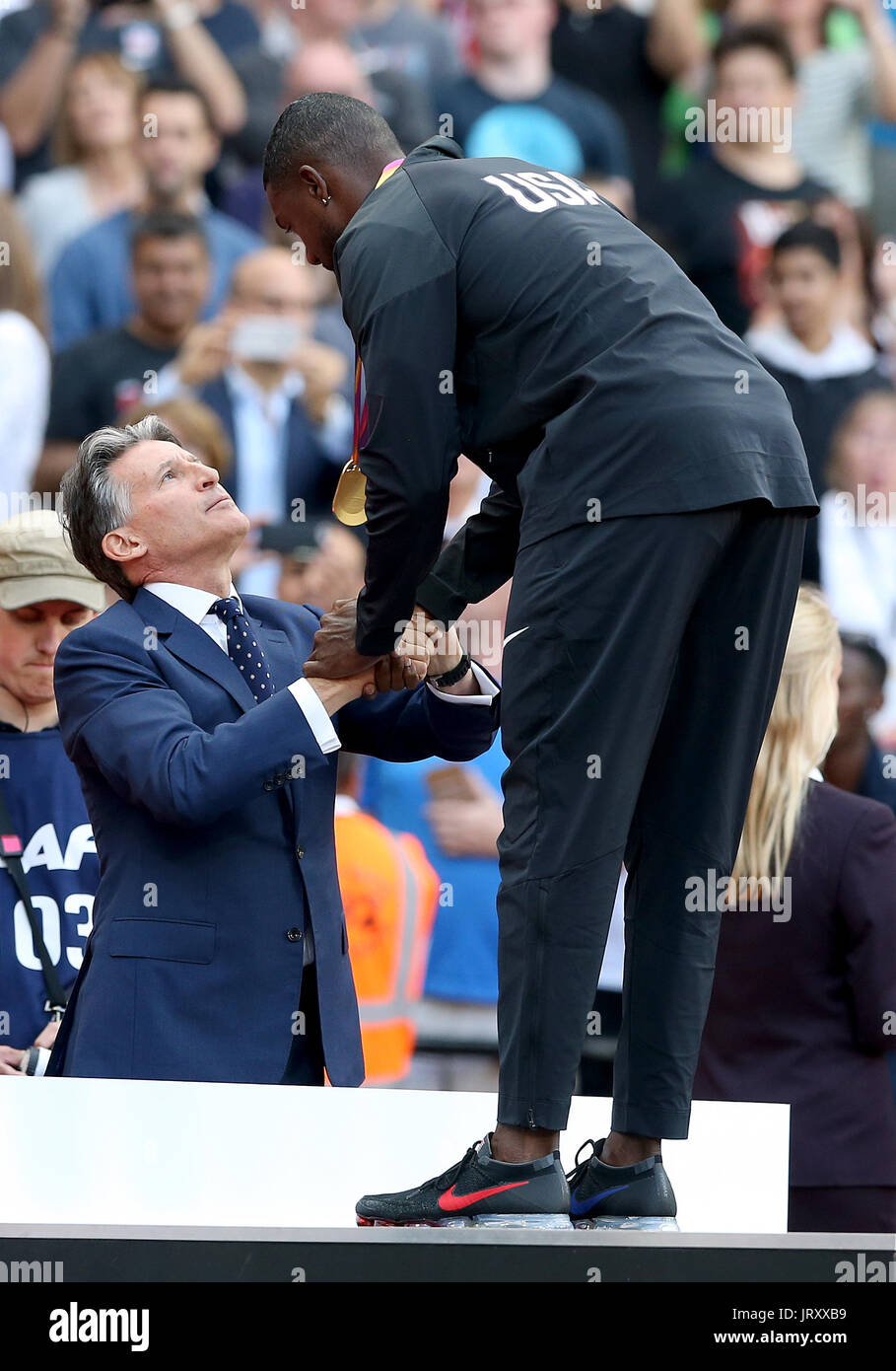 IAAF President Lord Sebastian Coe gives the gold medal to USA's Justin ...