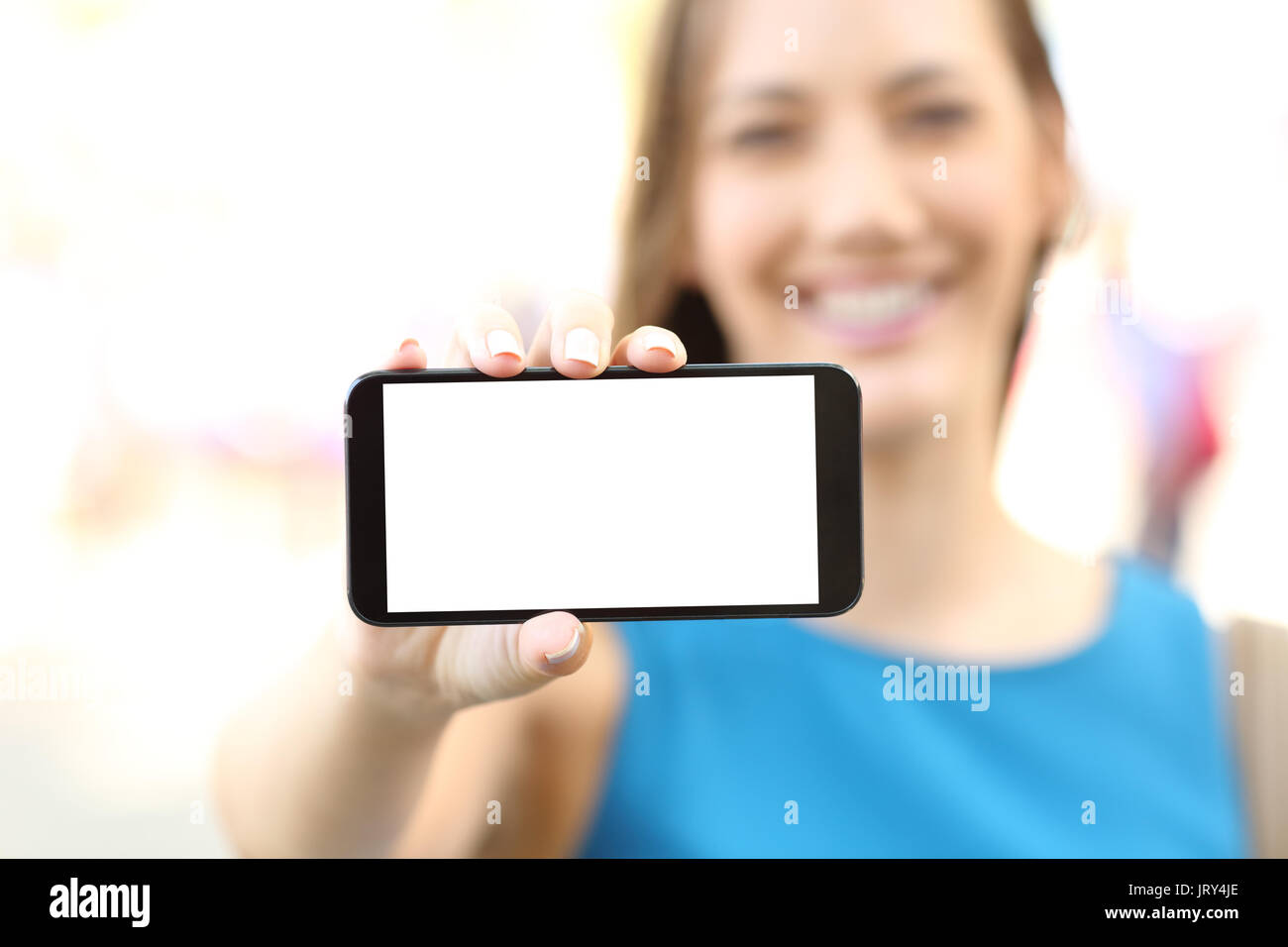 Close up of a happy female showing a blank horizontal phone screen on ...