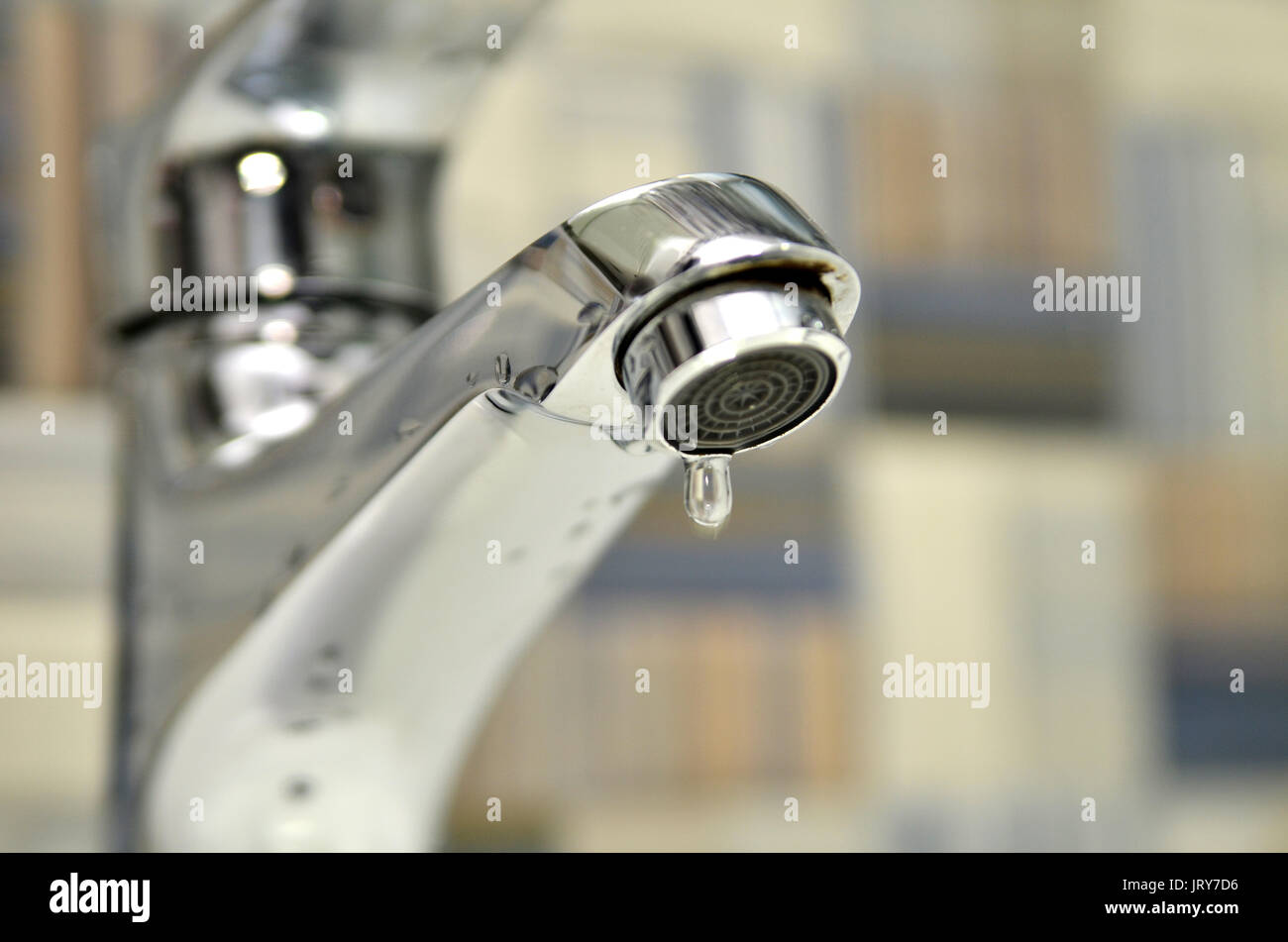 Bathroom tap leaking water drops. Saving water concept Stock Photo - Alamy