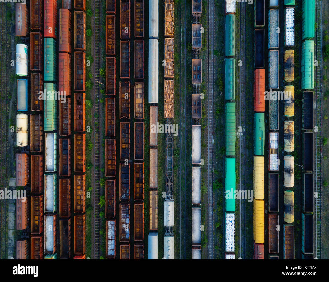 Cargo trains close-up. Aerial view of colorful freight trains on the ...
