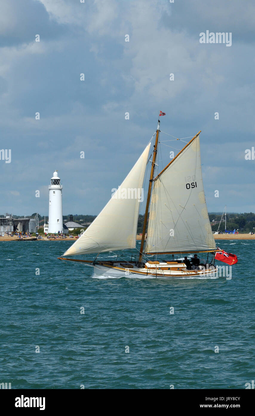 A classic gaff rigged sailing boat or yacht on the solent passing the ...