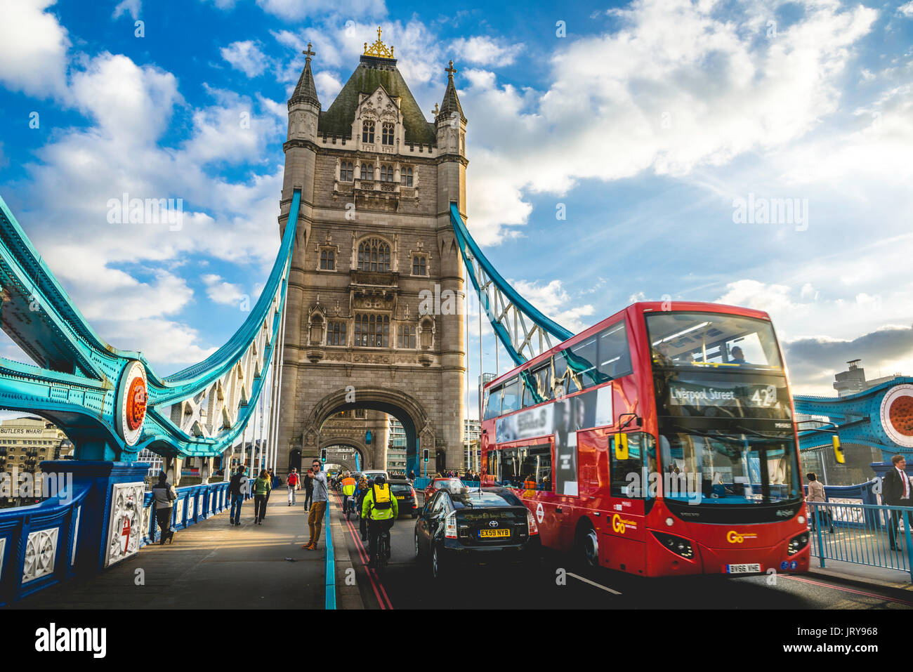 Red double-decker bus on the Tower Bridge, Southwark, London, England ...