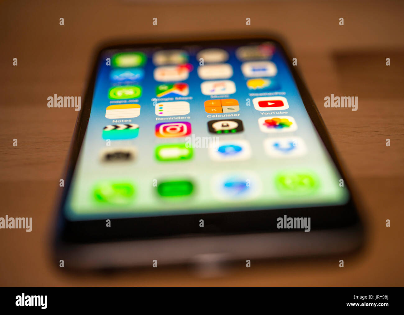 IPhone lying on table, luminous display, screen, iPhone, many different ...