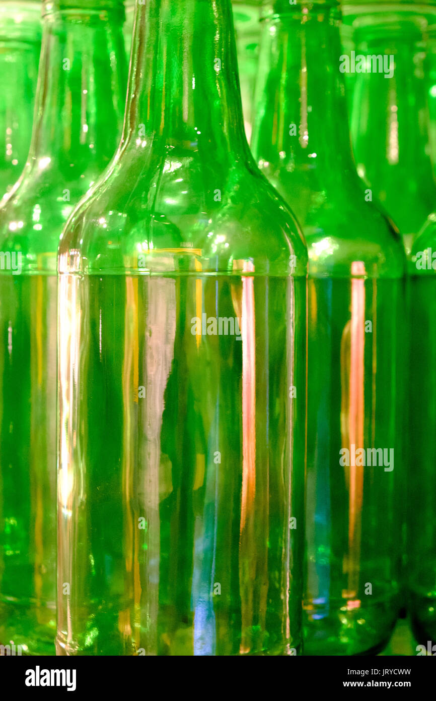 Rows of green glass bottles in "Glass: Shattering Notions" gallery in ...