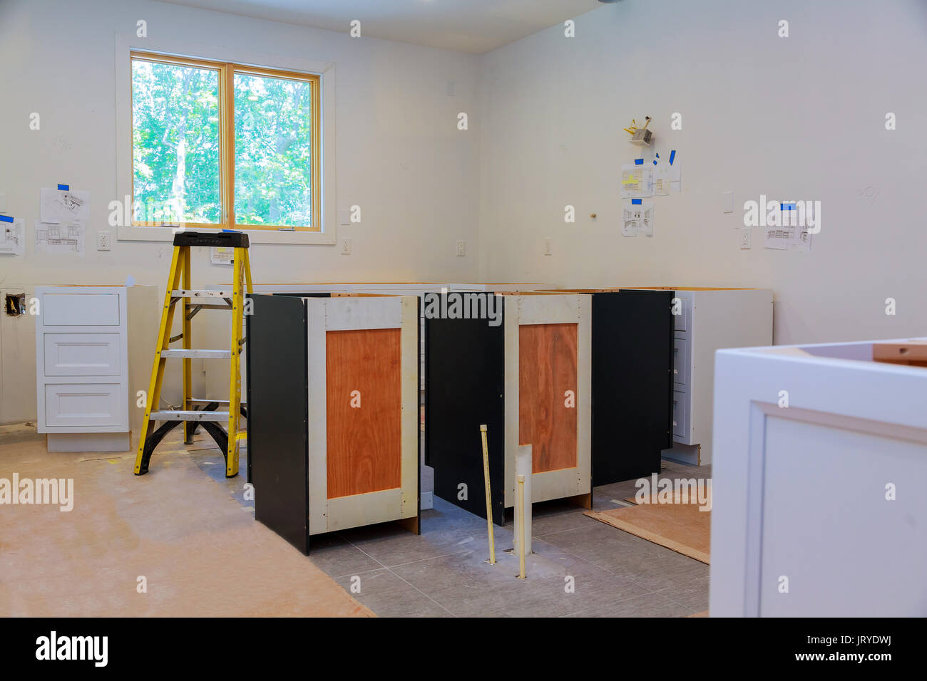 Custom kitchen cabinets in various stages of installation base for ...
