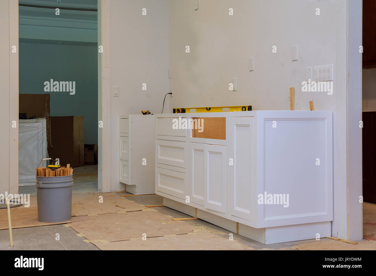 Installing new induction hob in modern kitchen Stock Photo - Alamy