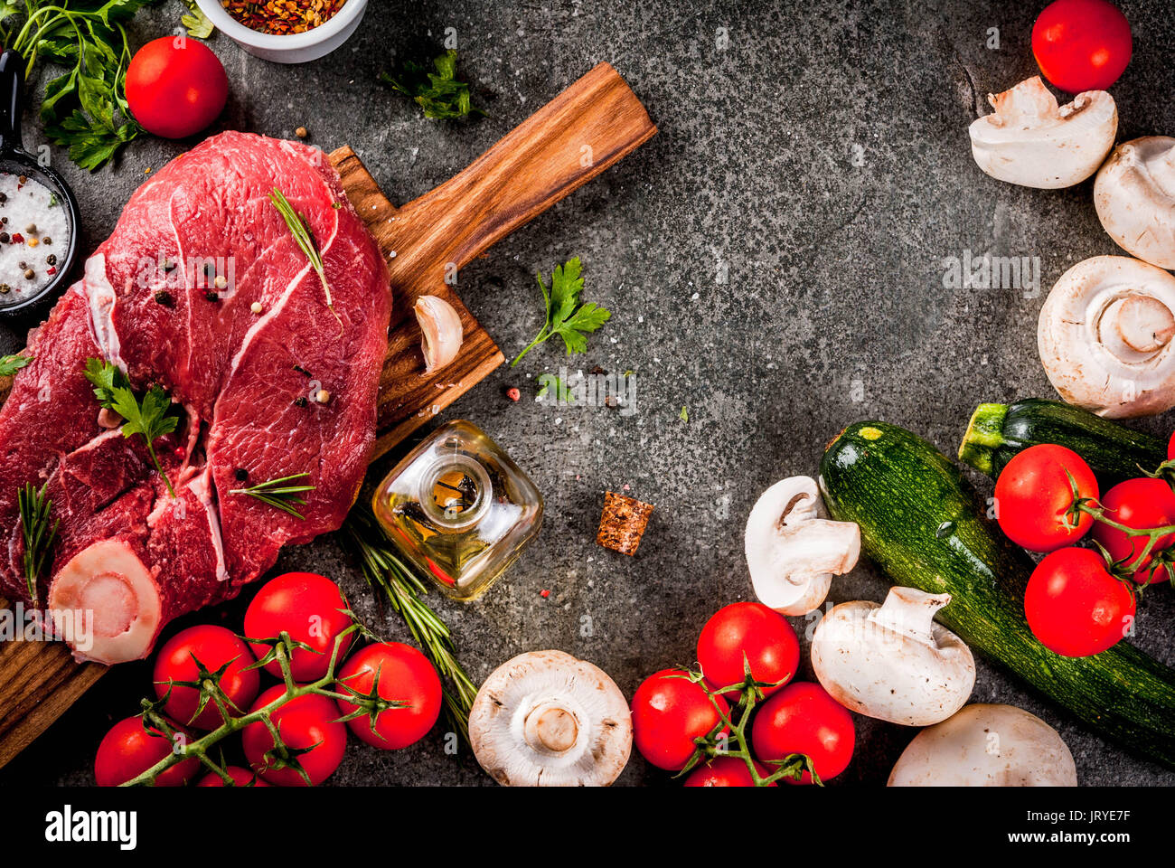 Raw meat with ingredients for dinner. Beef fillet, tenderloin, on ...