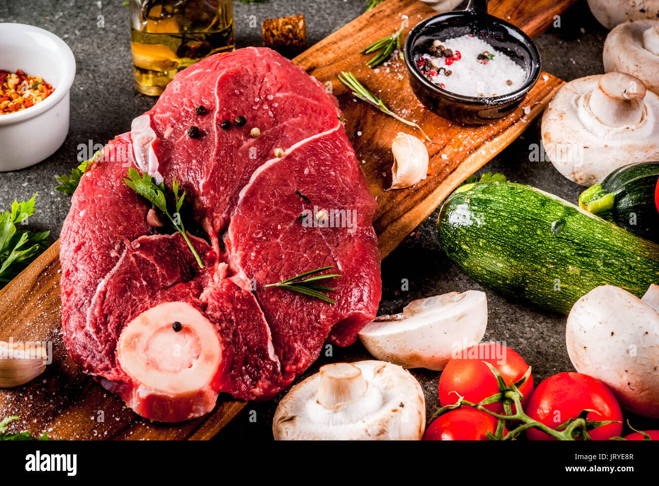 Raw meat with ingredients for dinner. Beef fillet, tenderloin, on ...