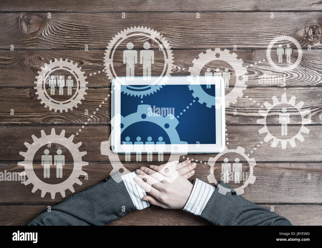 Concept of teamworking and connection with gears mechanism and tablet ...