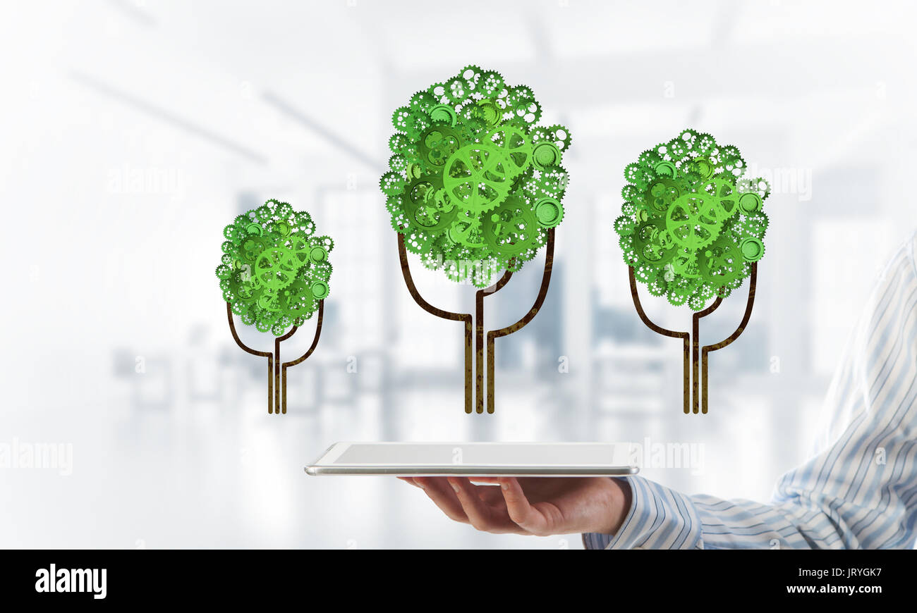 Eco green environment concept presented by tree as working mechanism or ...