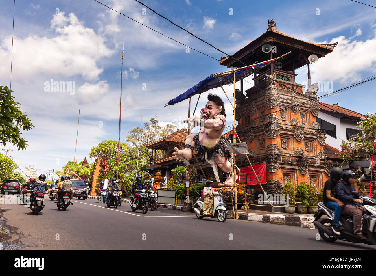 Traditional balinese guardian statue at entrance Bali temple with ...