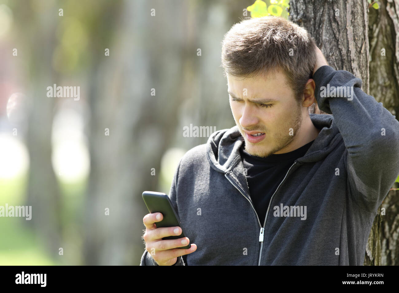 Teen boy confused reading hi-res stock photography and images - Alamy
