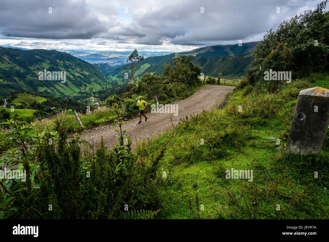 A young male trail runner in a green valley near Cuenca, Ecuador Stock Photo - Alamy