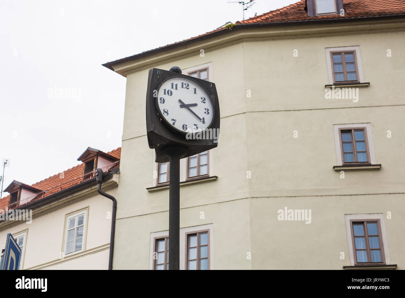street clock with building background Stock Photo - Alamy