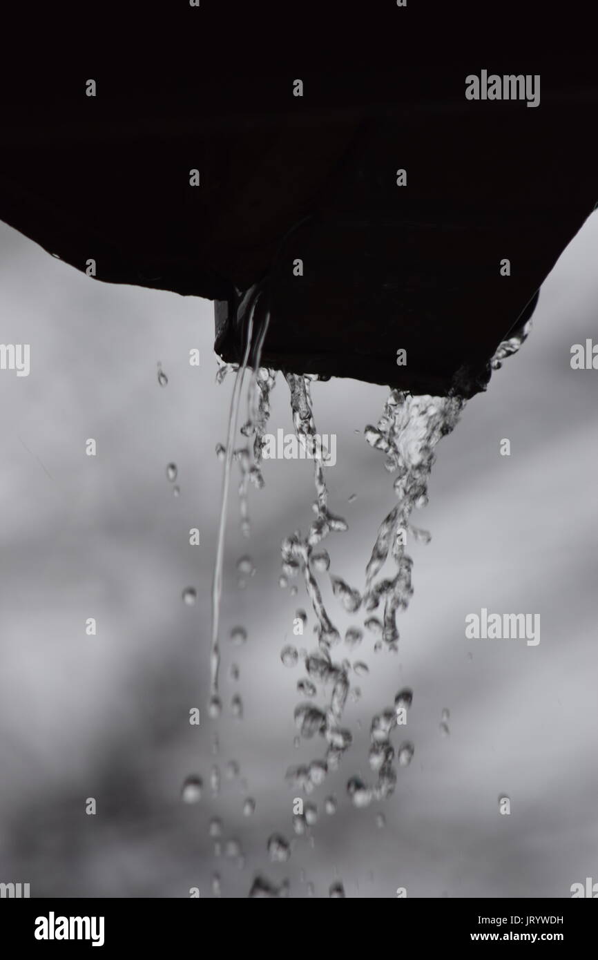 Water overflowing from gutter Stock Photo - Alamy