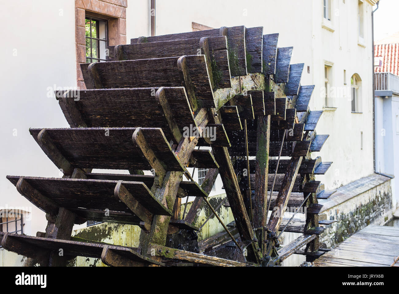 Working watermill wheel with falling water in the village Stock Photo ...