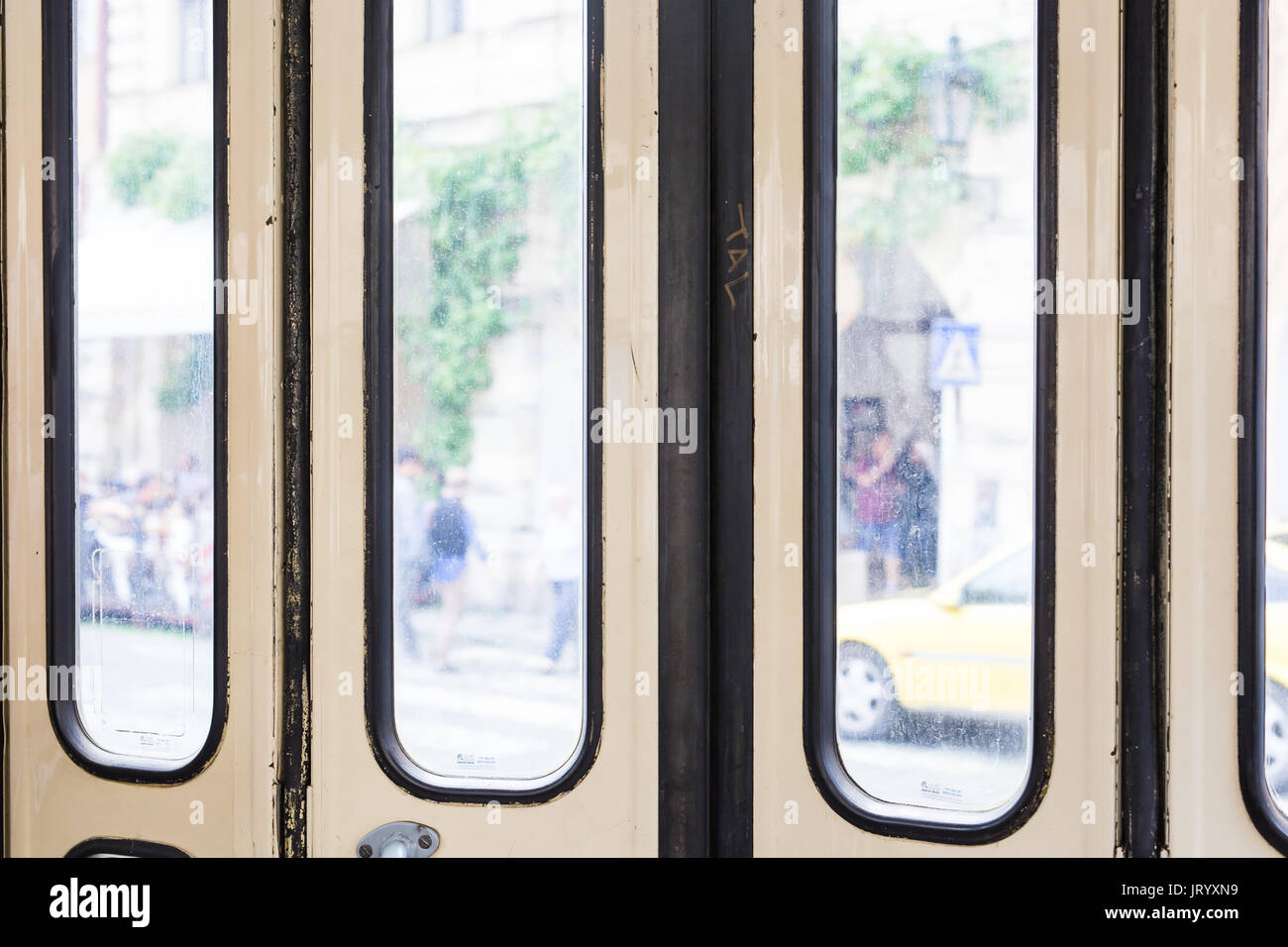 Closed entrance door in tram Stock Photo - Alamy