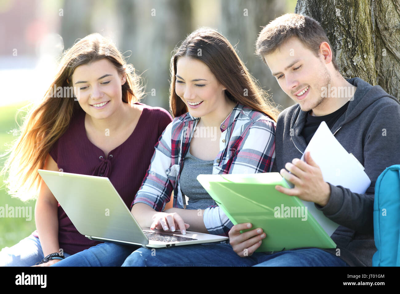 Group of students working on a computer hi-res stock photography and ...