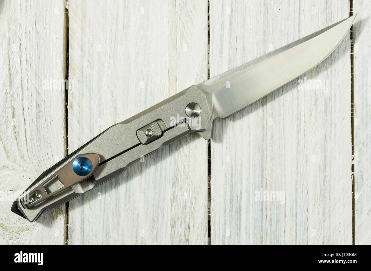 Steel knife with a mirror-shining blade. Back side. White background ...