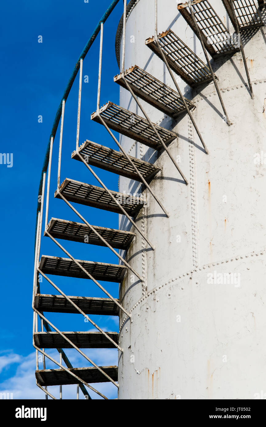 Gasoline storage tank with staircase along side creating patterns Stock ...