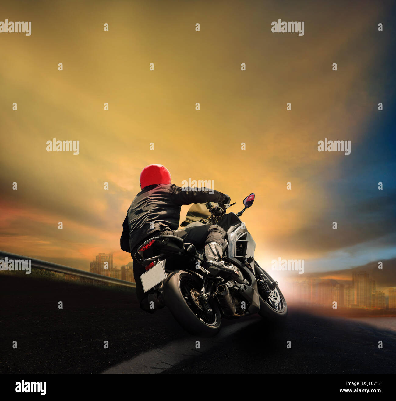 young man riding motorcycle on asphalt highways road with high speed ...