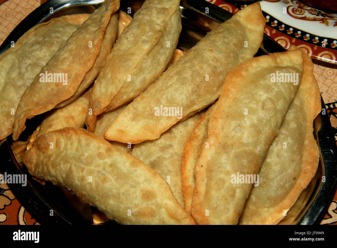 Mouth watering Indian delicacy of sweet stuffed pudding Stock Photo - Alamy
