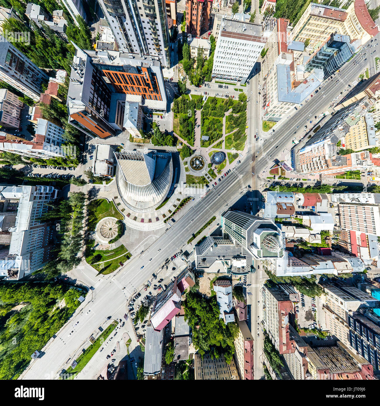 Aerial city view with crossroads, roads, houses, buildings, parks and ...