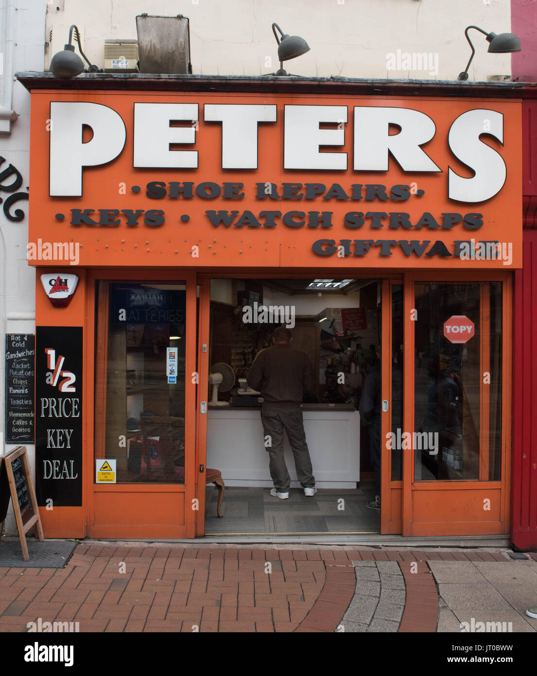 Close-up shots of shoe repair tools and footwear in a traditional ...