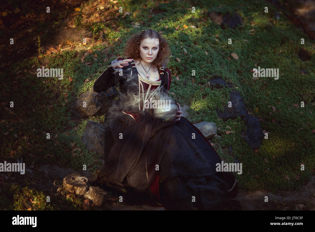 Woman Is Engaged In Magic She Cooks A Magic Potion Stock Photo Alamy