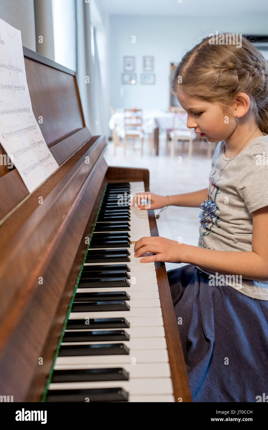 Teenage girl playing piano hi-res stock photography and images - Alamy