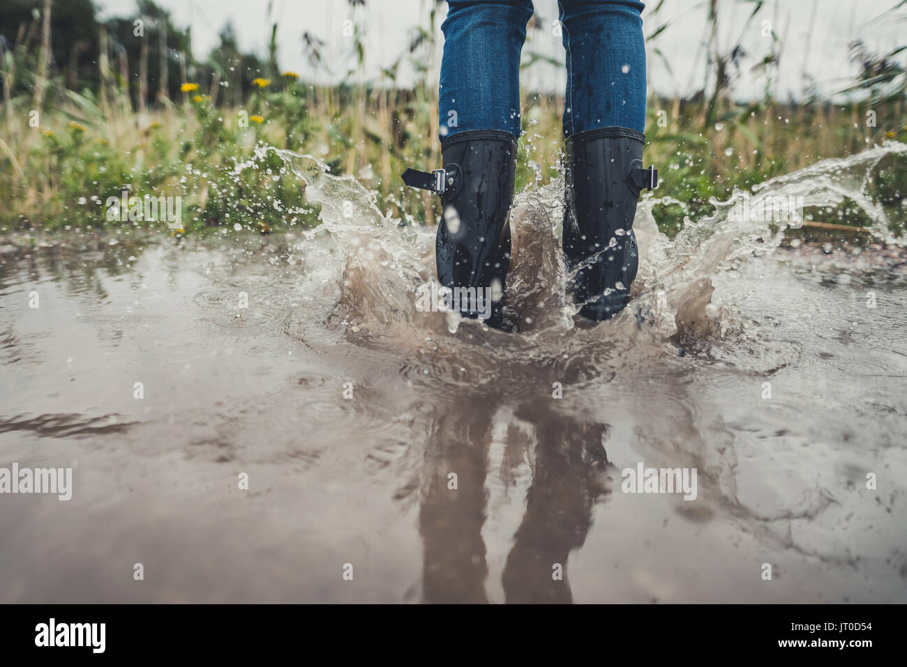 Legs in rubber boots hi-res stock photography and images - Alamy