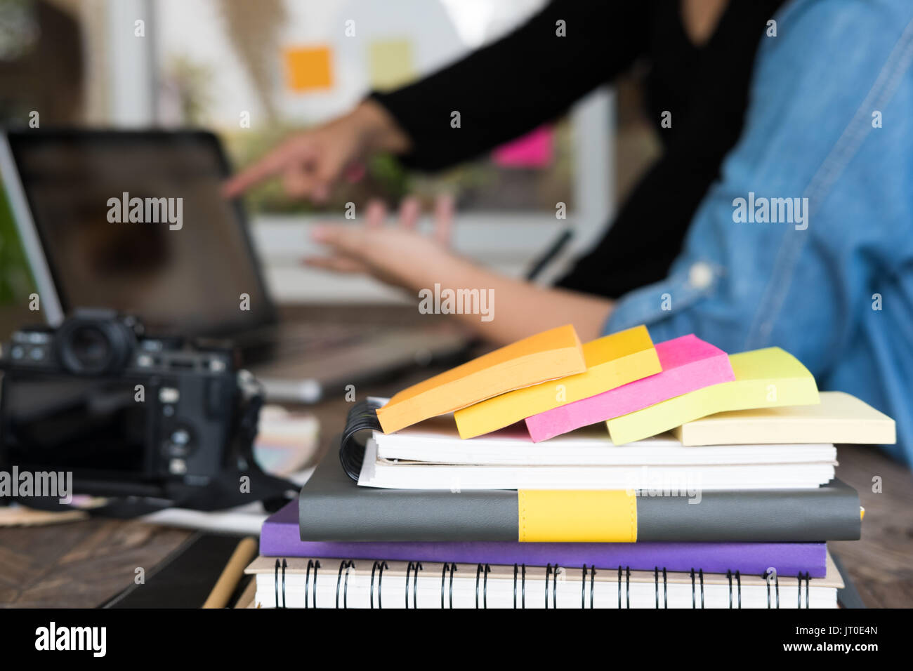 graphic designer working with computer at workplace. artist discussing ...