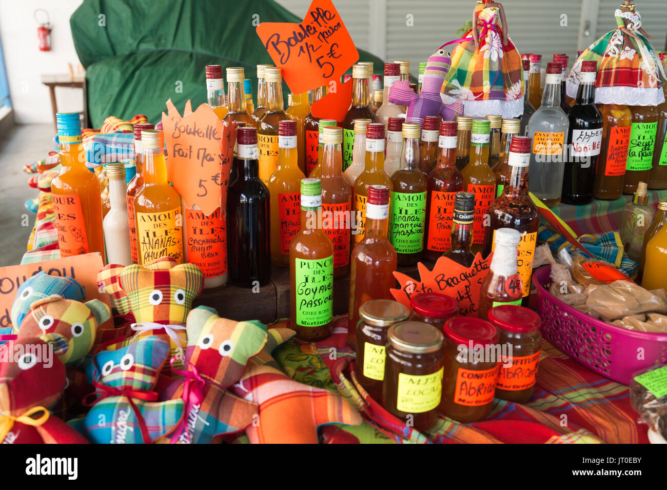 Traditional flavored rum bottles at the market in Martinique, Caribbean ...