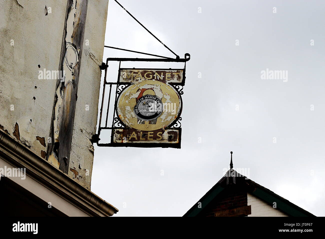 Old sign used for multiple business over generations, outside antique ...