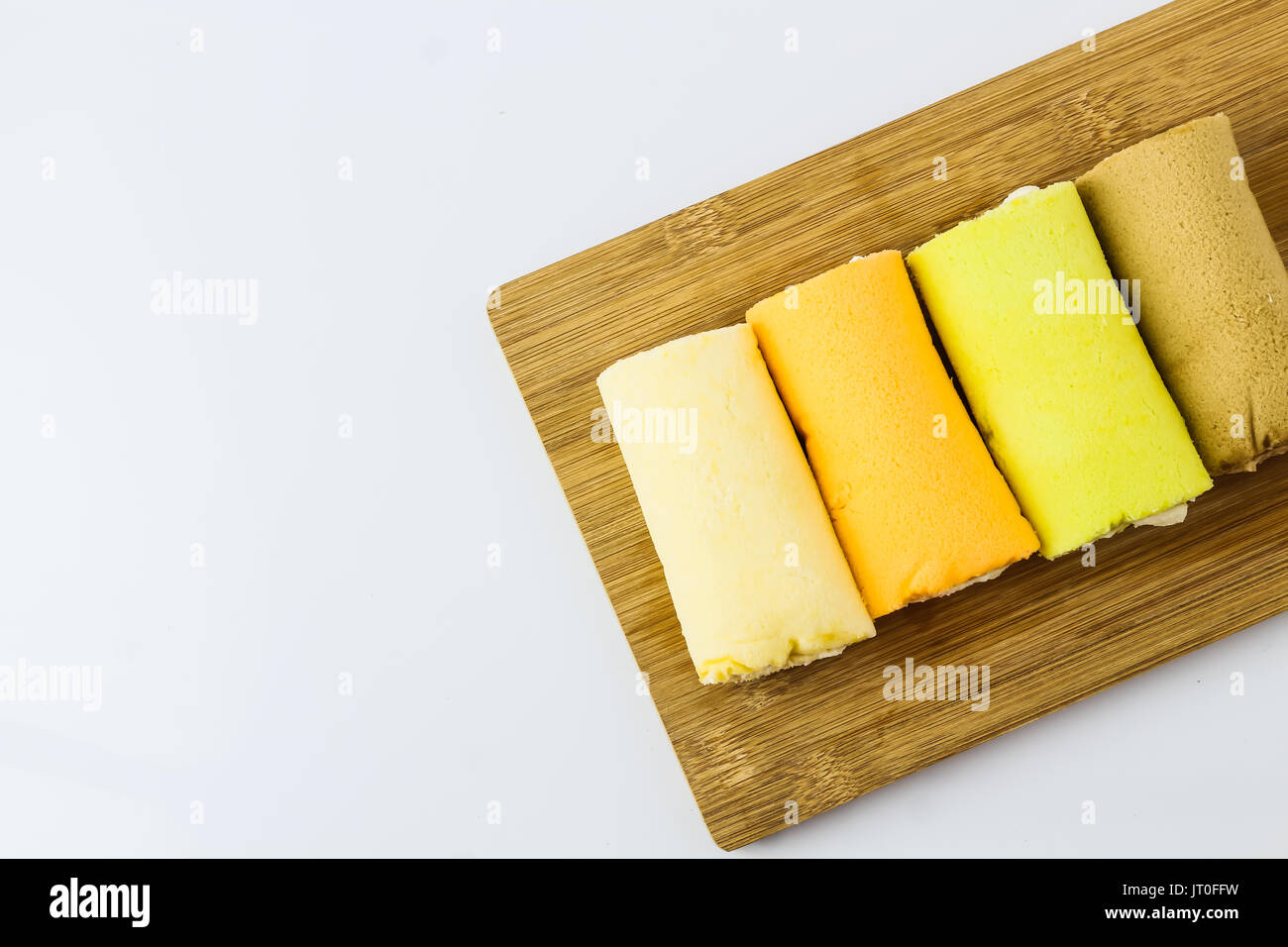 cake roll flat lay on white isolated Stock Photo - Alamy