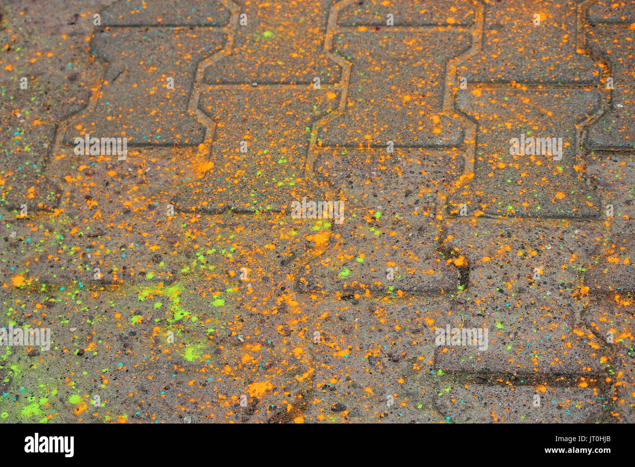 Multi-colored earth, paving slabs, powder coated with dry colors at the ...