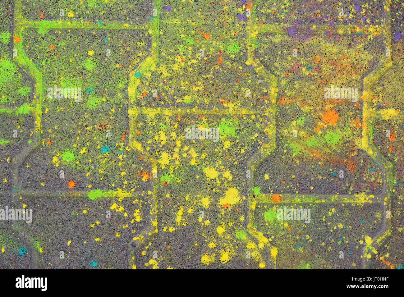 Multi-colored earth, paving slabs, powder coated with dry colors at the ...