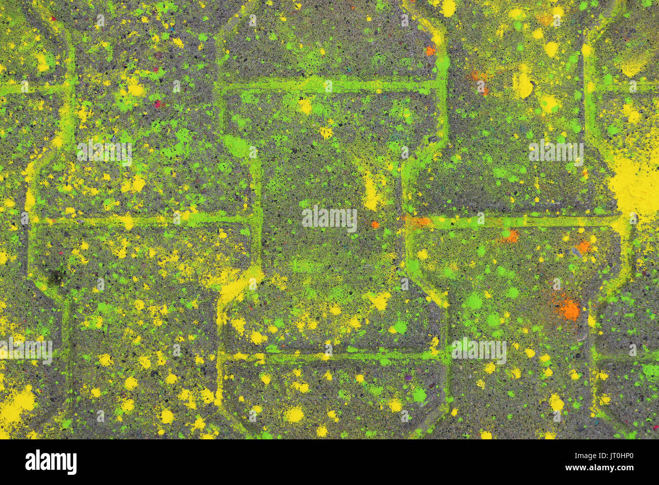 Multi-colored earth, paving slabs, powder coated with dry colors at the ...