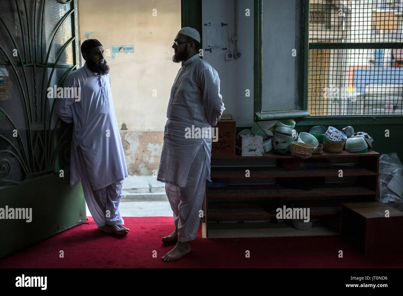 Athens, Greece. 6th July, 2017. Two Muslims are standing in the ...